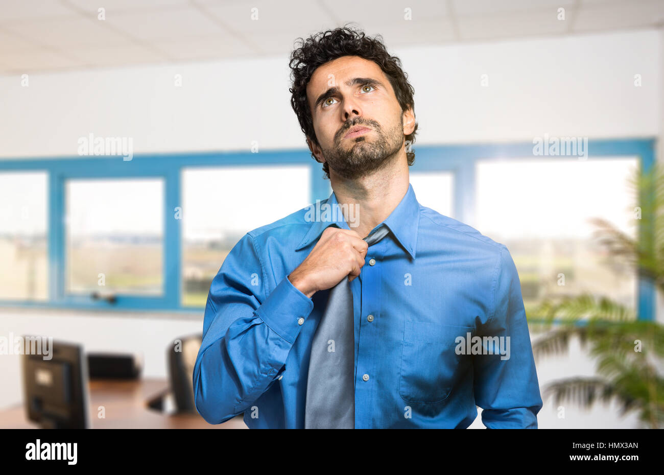 Sweating businessman due to hot climate Stock Photo - Alamy