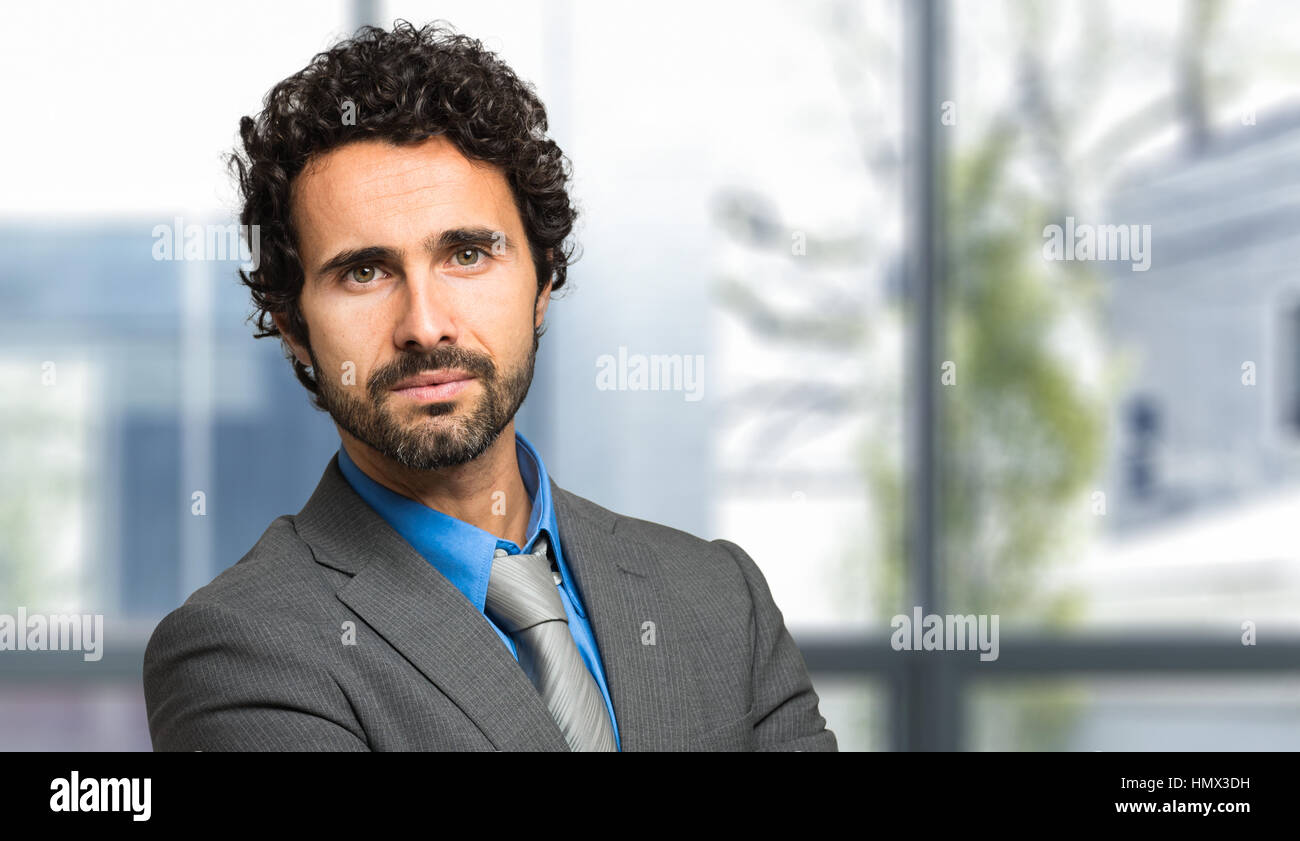 Handsome manager in his office Stock Photo - Alamy