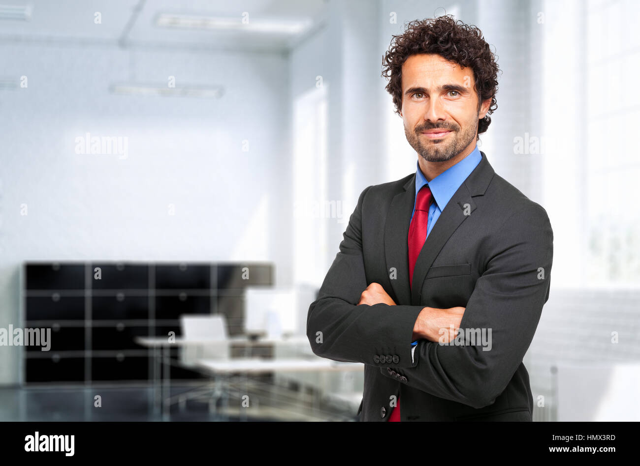 Handsome manager in his office Stock Photo - Alamy