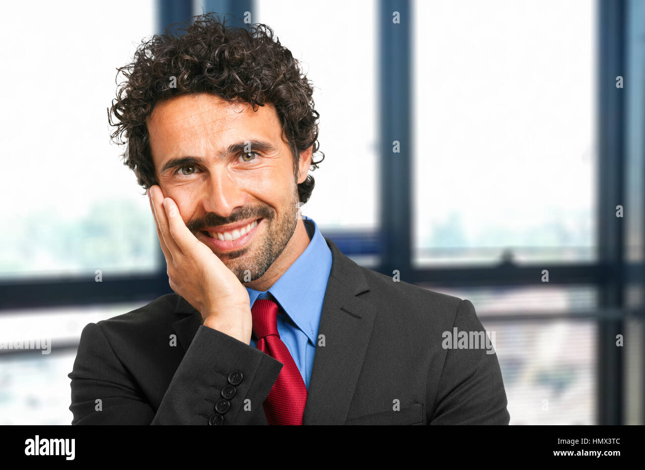 Handsome manager in his office Stock Photo - Alamy