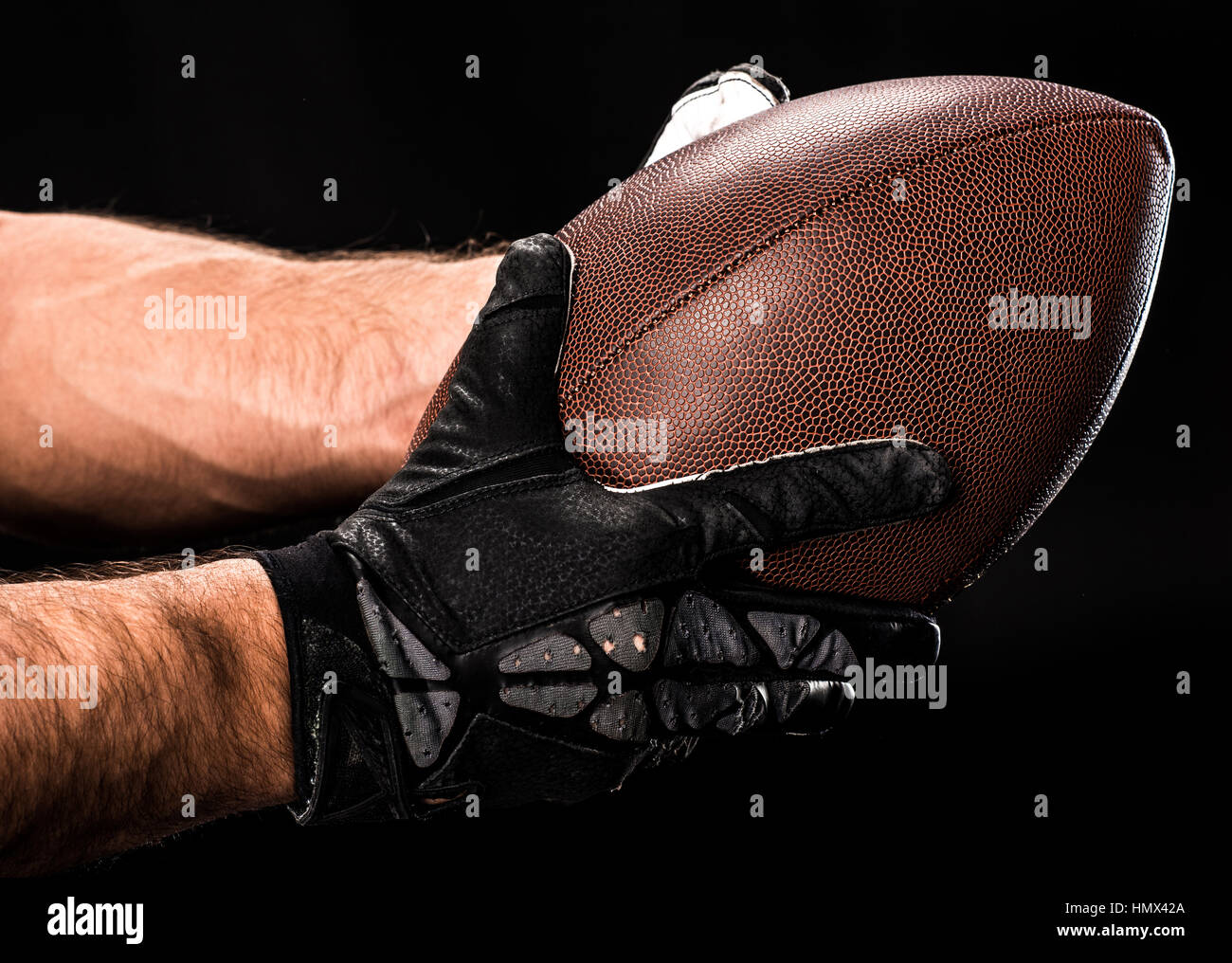 Hands holding football hi-res stock photography and images - Alamy