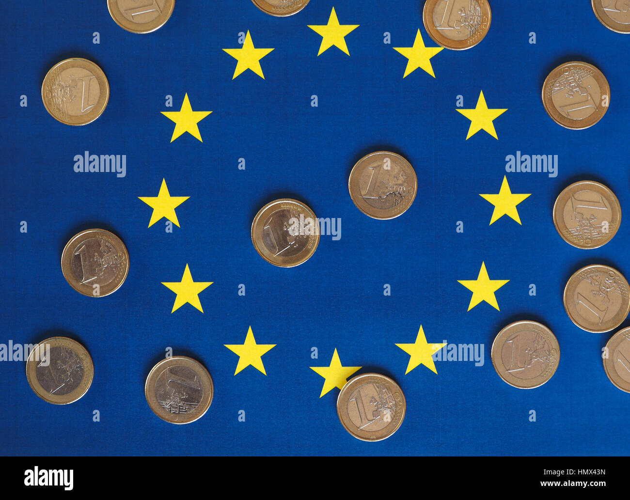 Euro coins (EUR), currency of European Union over flag of Europe Stock ...
