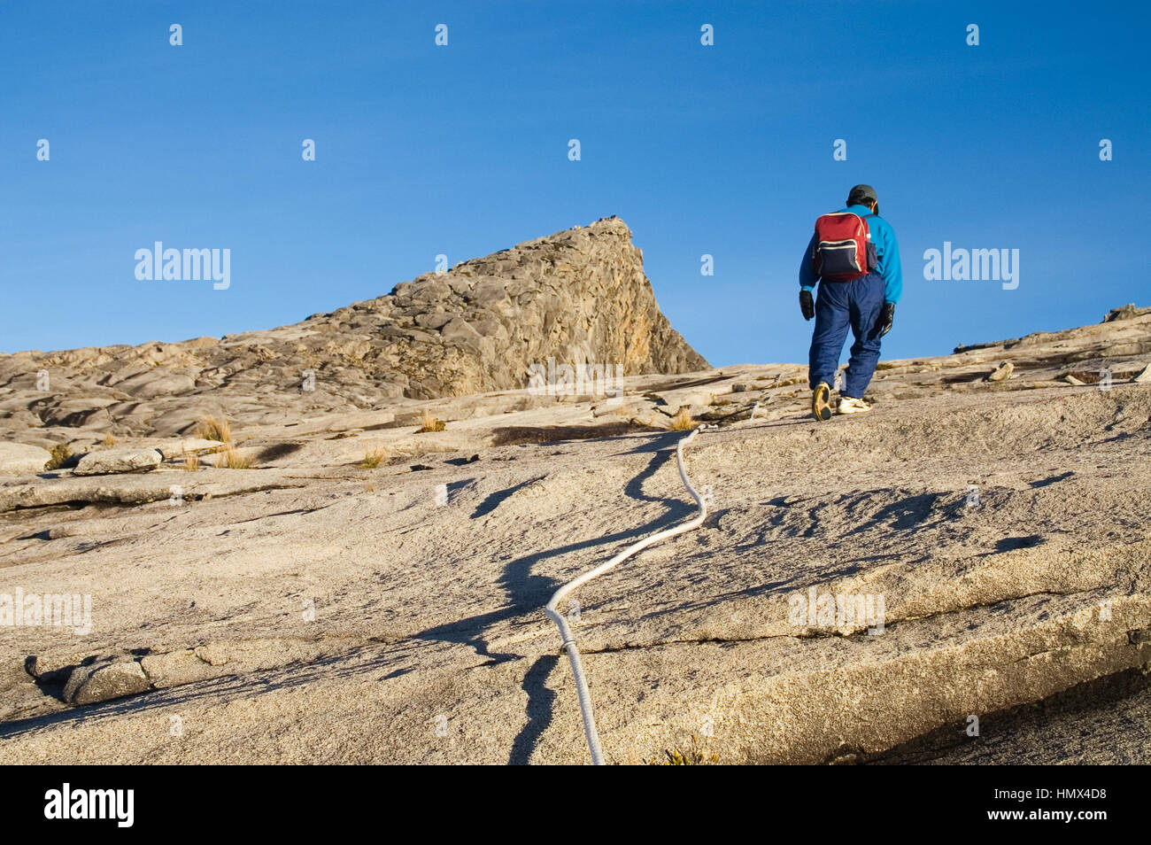 man walking up steep slopes of Mount Kinabalu in Sabah, Malaysia Stock ...