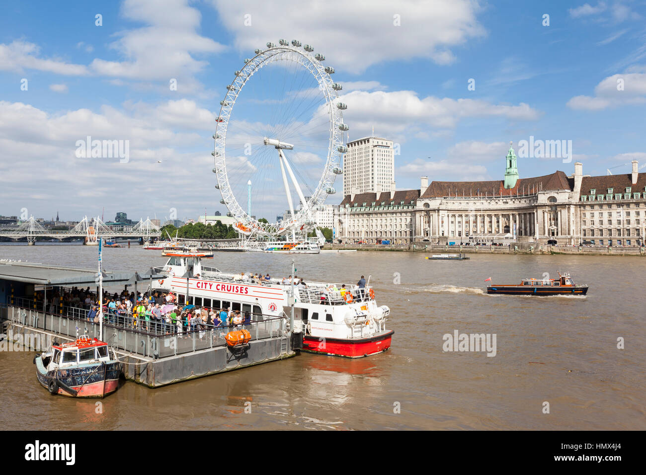 London, United Kingdom - September 4, 2012: Tourists board a tour boat ...
