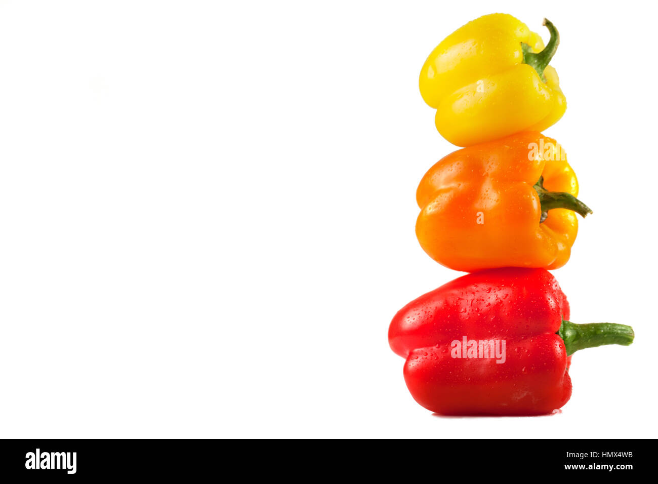 Bright, delicious, juicy sweet peppers making pyramid together isolated ...