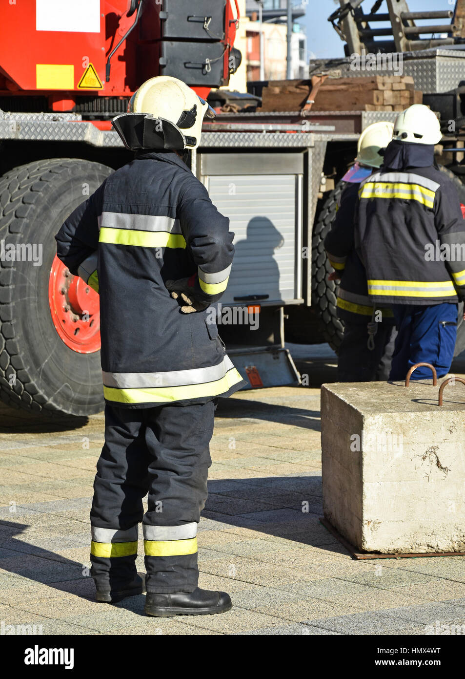 Firefighters at work outdoor Stock Photo - Alamy