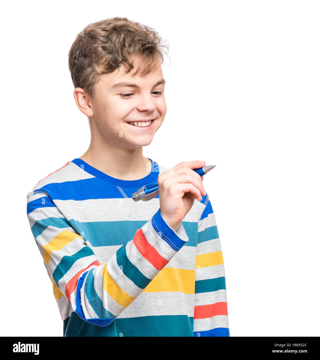 Teen boy with pen writing something Stock Photo - Alamy