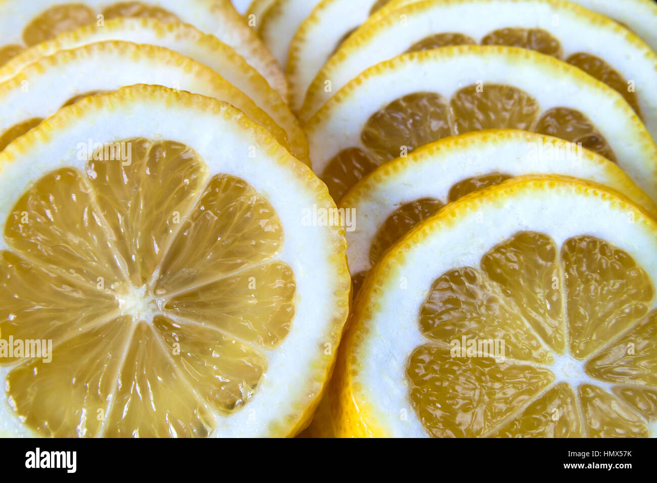 Juicy yellow slices of lemon background Stock Photo - Alamy