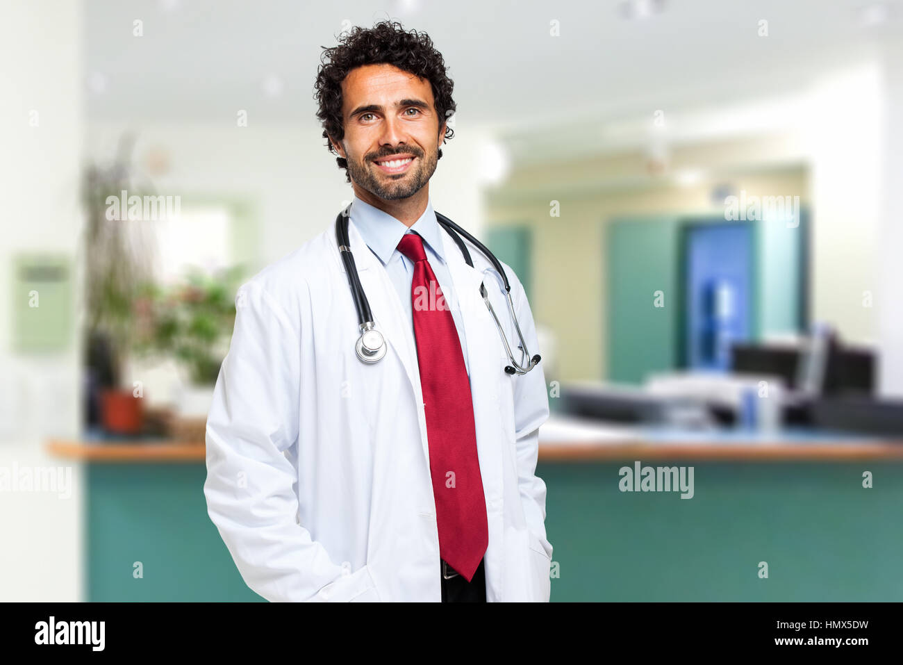 Portrait of a friendly doctor smiling Stock Photo - Alamy