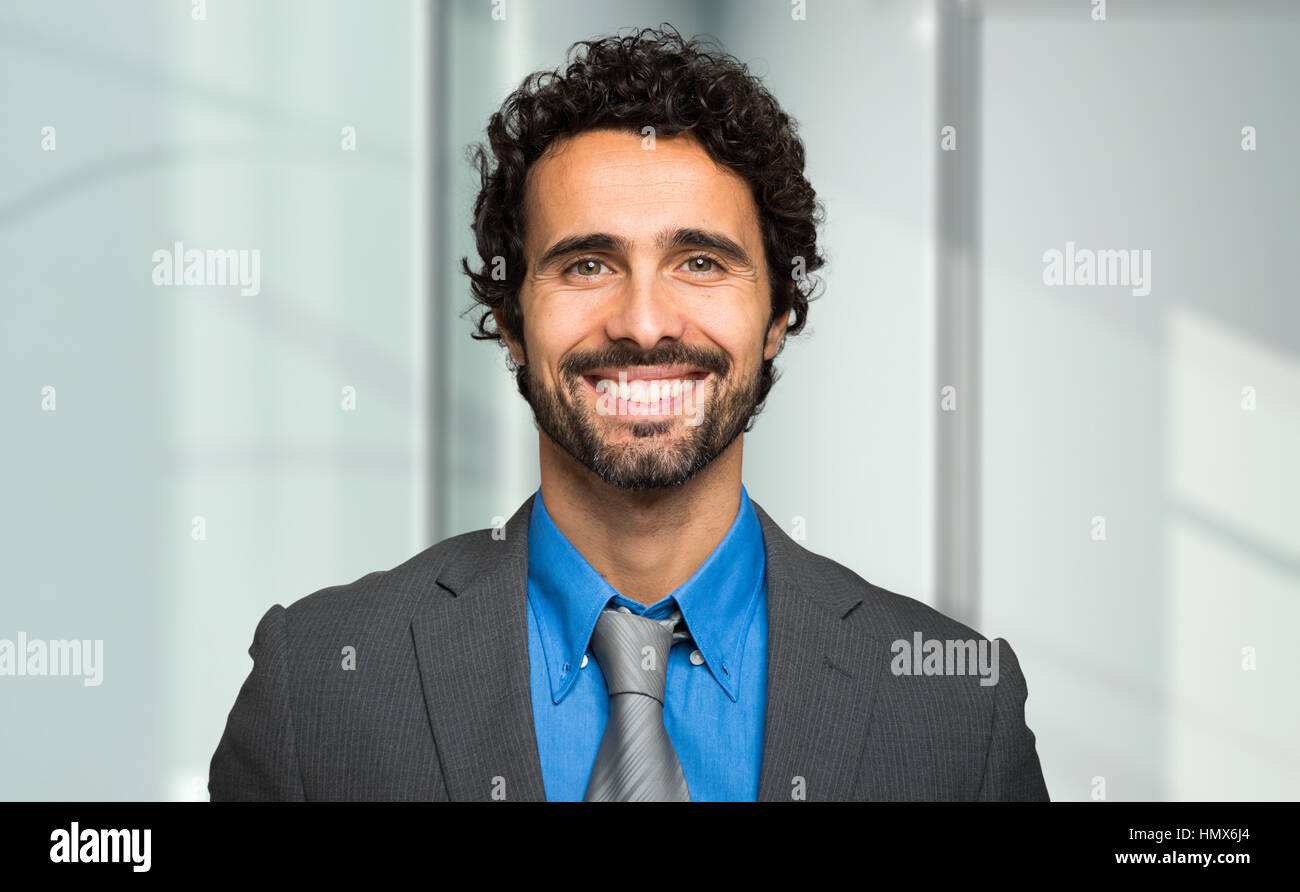 Portrait of a friendly businessman Stock Photo - Alamy