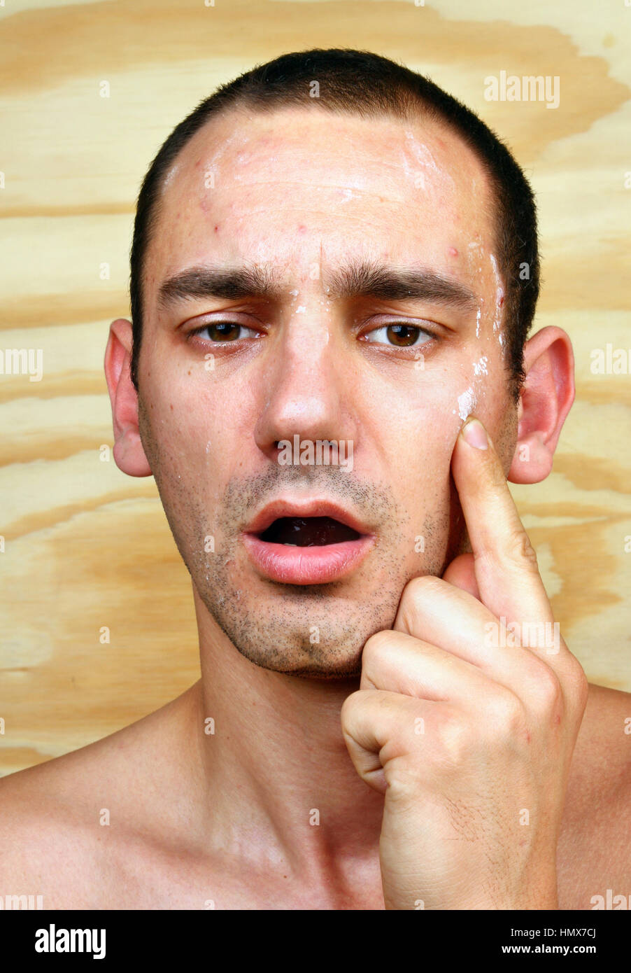 Young man shows a hand your infection of the skin on the face Stock ...
