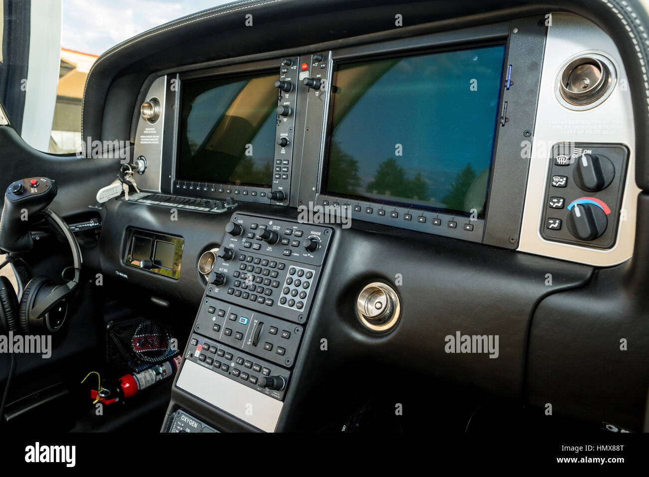 The dashboard sports a small aircraft navigation devices and two large ...