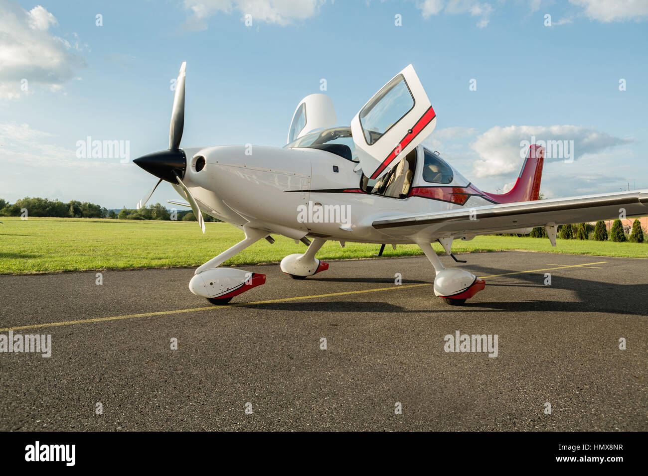 Single turboprop aircraft on the ground in sunny day, cirrus, SR22 ...