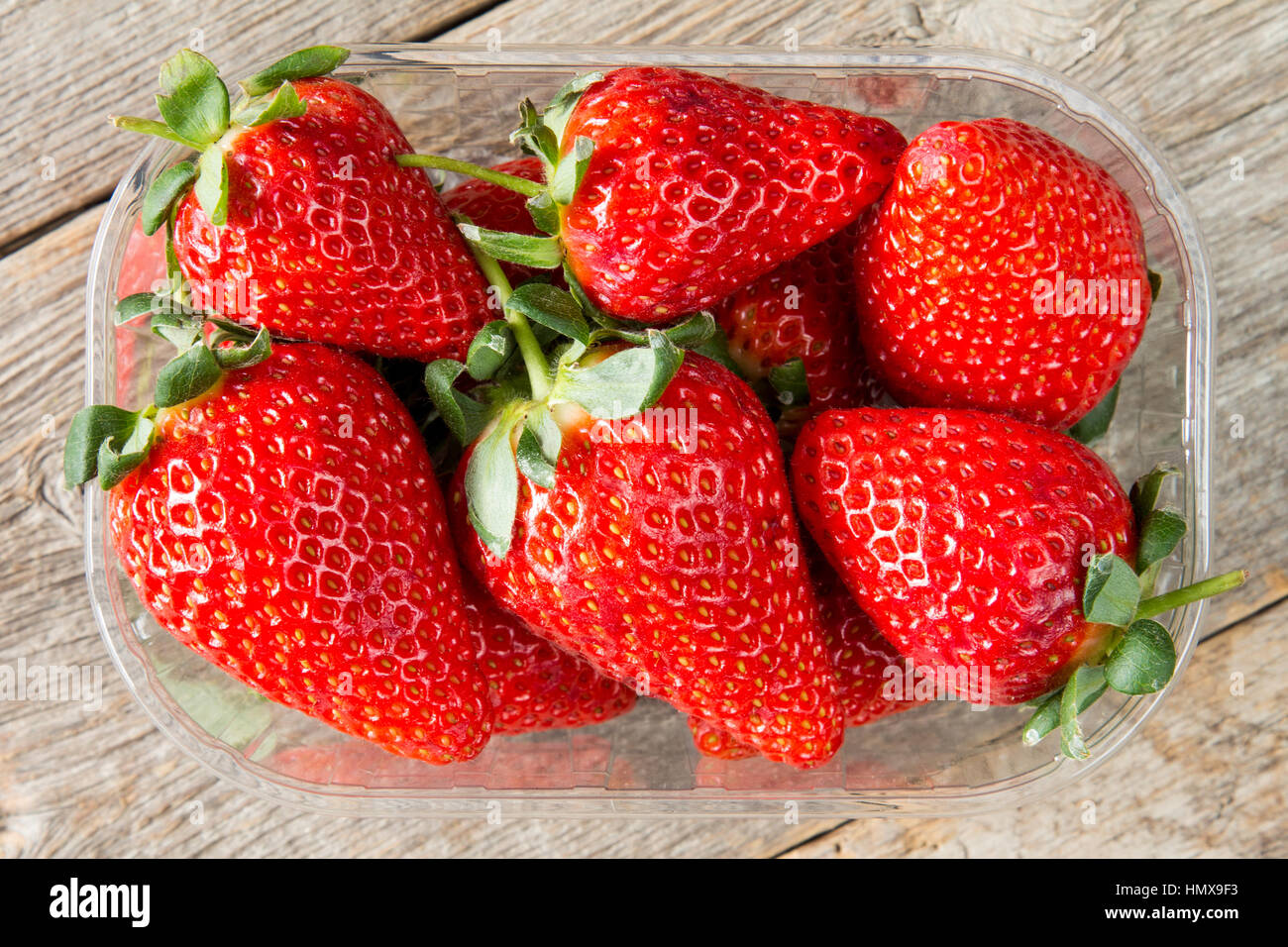 Plastic box full of red strawberries. Top view Stock Photo - Alamy