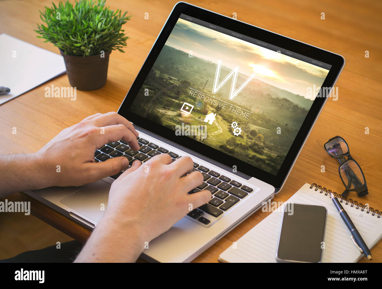web design concept. Close-up top view of a coolhunter working on laptop ...