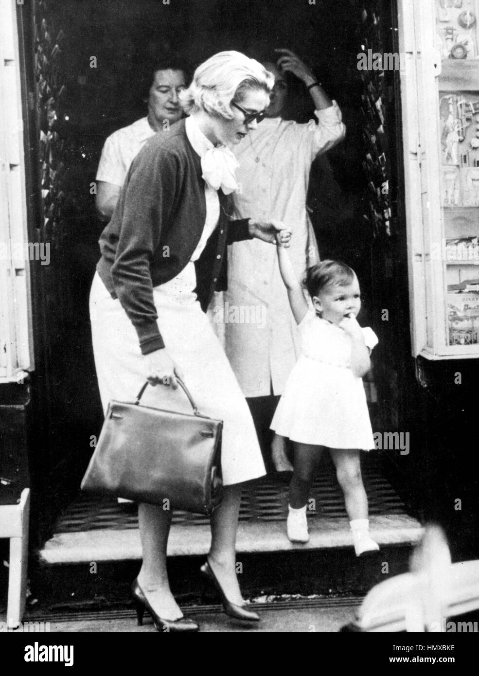 Princess Grace holds the hand of her daughter, Princess Caroline ...