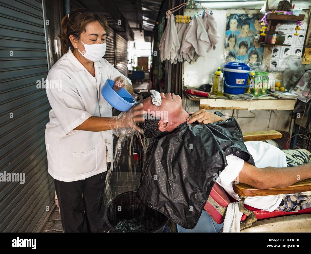 Bangkok, Bangkok, Thailand. 6th Feb, 2017. A barber washes a customer's ...