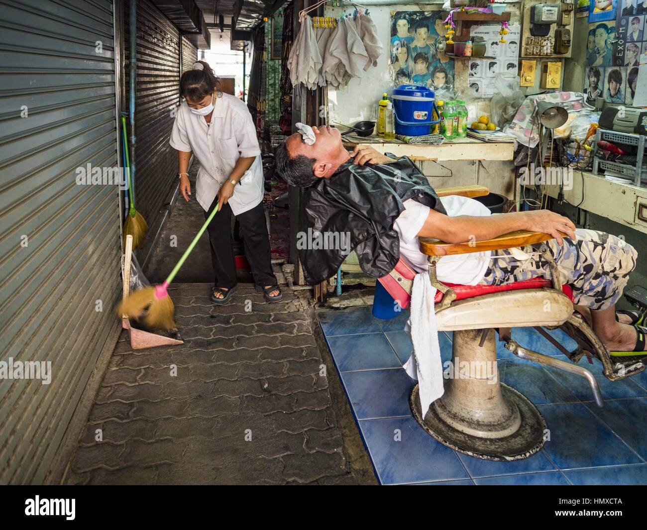 Bangkok, Bangkok, Thailand. 6th Feb, 2017. A barber sweeps up her shop ...