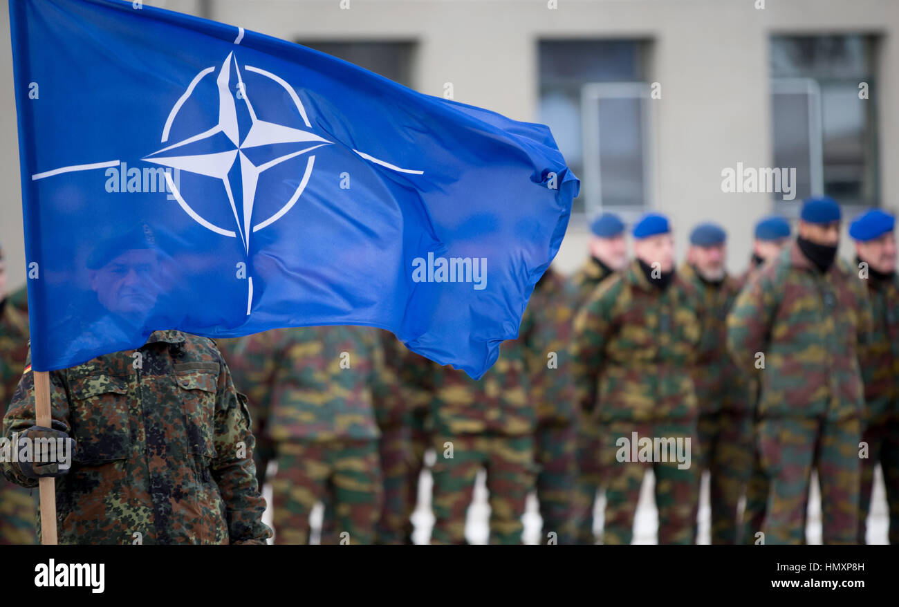Rukla, Lithuania. 07th Feb, 2017. A German soldier hoists the Nato flag ...