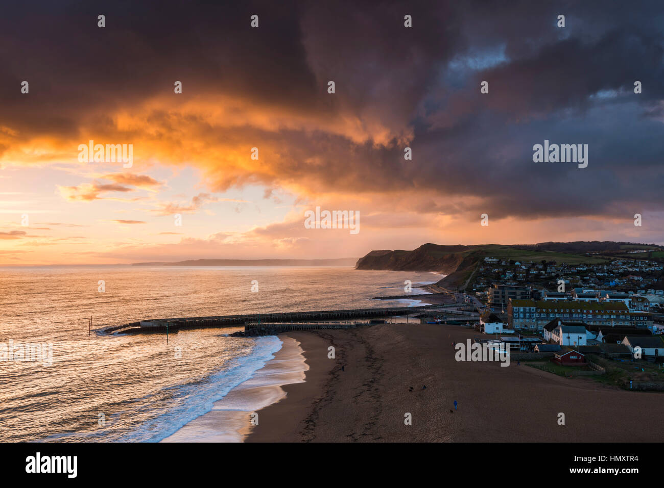 West Bay, Dorset, UK. 7th February 2017. UK Weather. Dark stormy shower ...