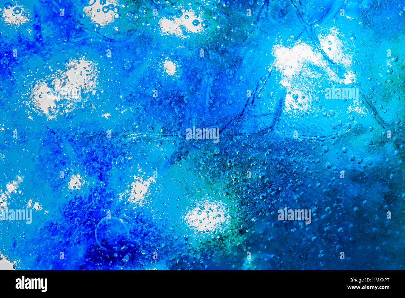 Frozen ice crystals with beautiful blue colour below. Large and small ...