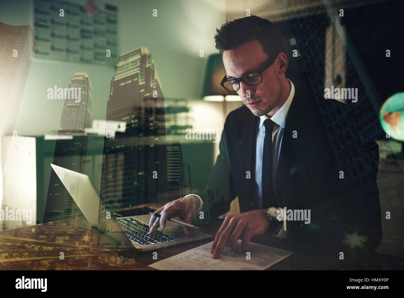 Serious business man working on documents looking concentrated with ...