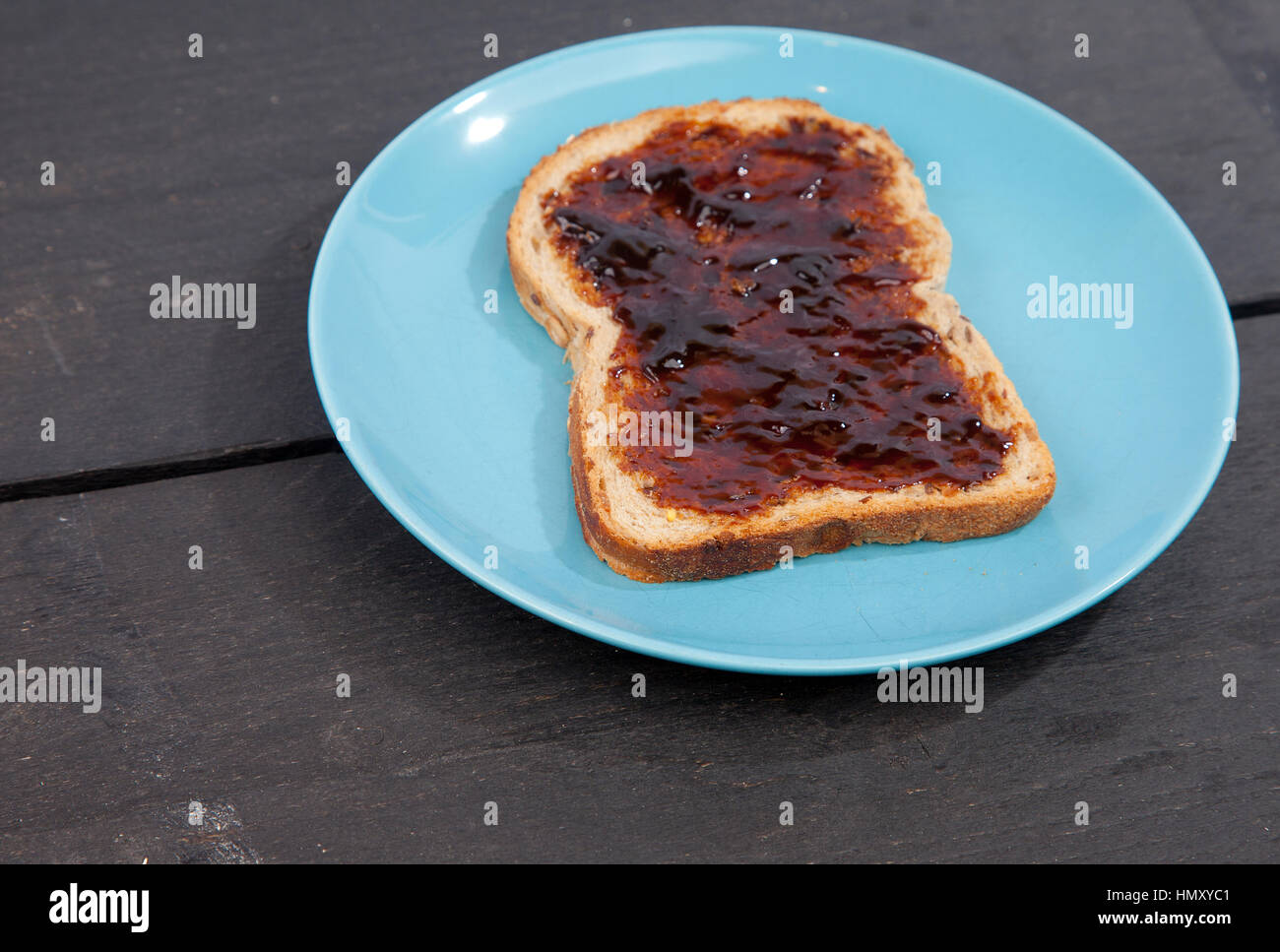 Typical Dutch apple syrup called Appelstroop on bread on wooden ...