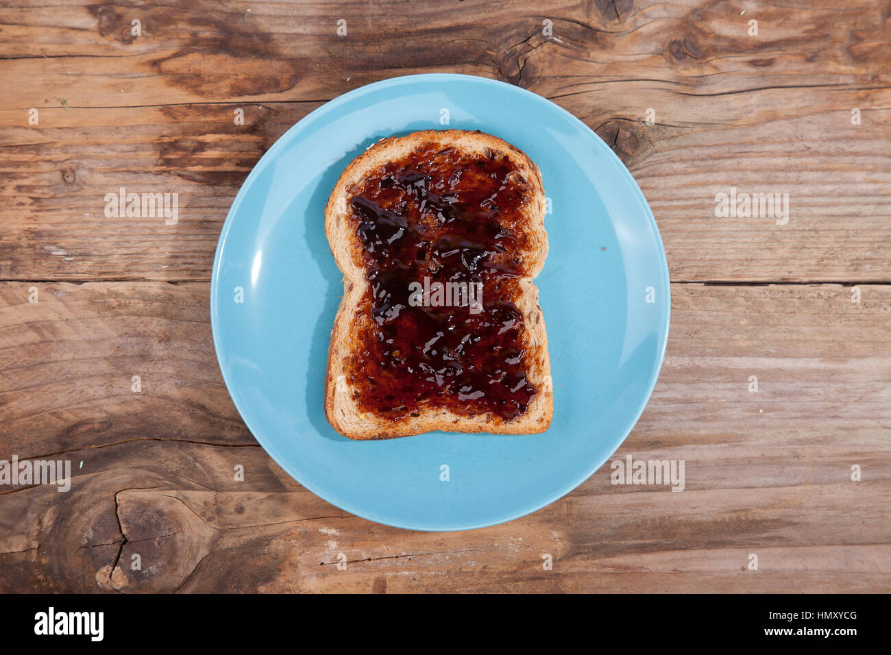 Typical Dutch apple syrup called Appelstroop on bread on wooden ...