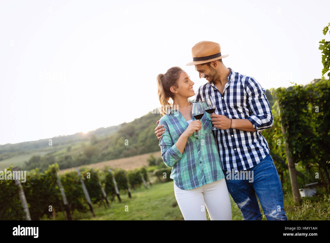 Happy people tasting wine in vineyard Stock Photo - Alamy