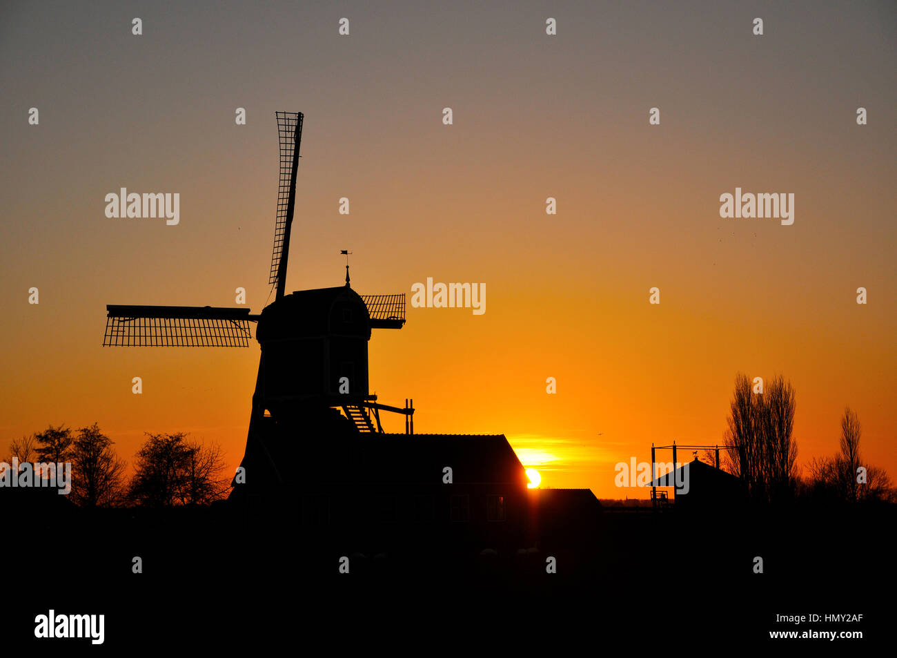 Silhouette of Dutch Windmill during sunset Stock Photo - Alamy