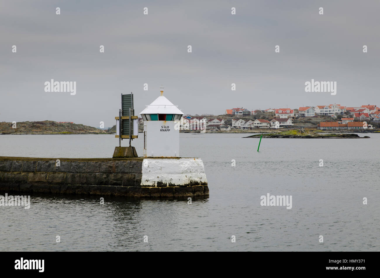 one old lighthouse on swedish westcoast standing on the pier in the ...