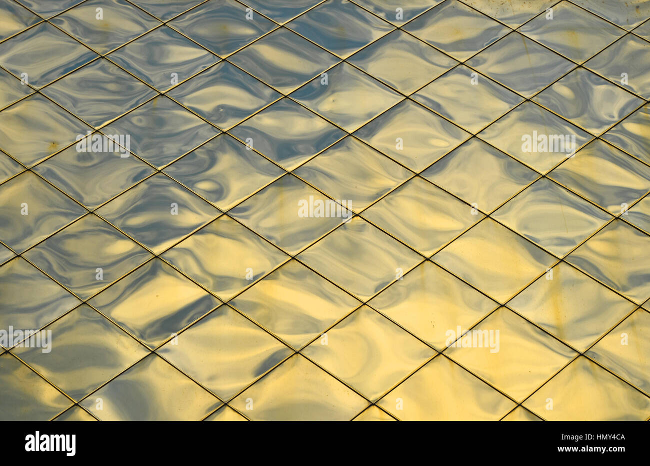 Golden metal shiny vivid rooftop tile panels texture background with ...