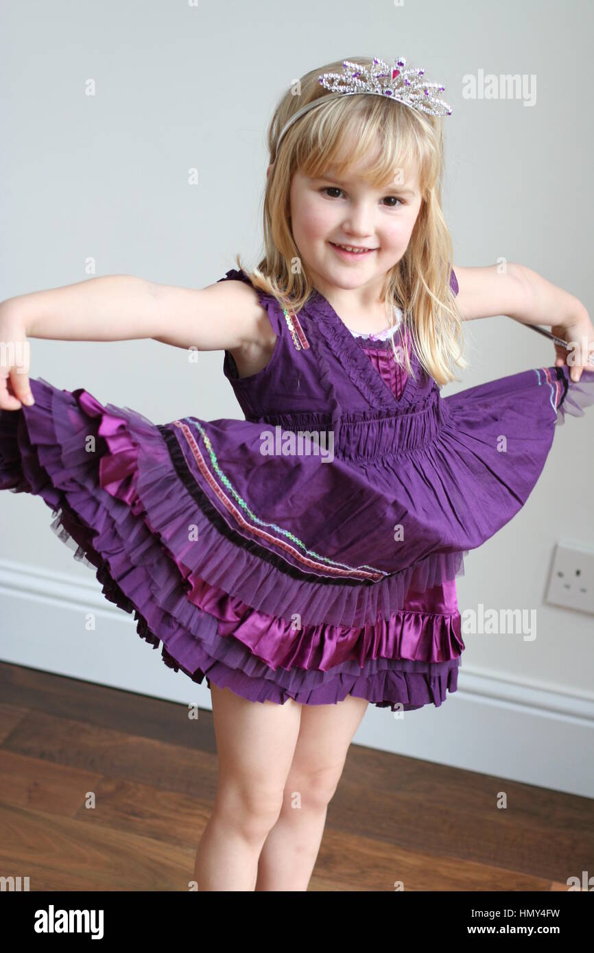 Little blonde girl kid child with brown eyes curtseying in a purple ...
