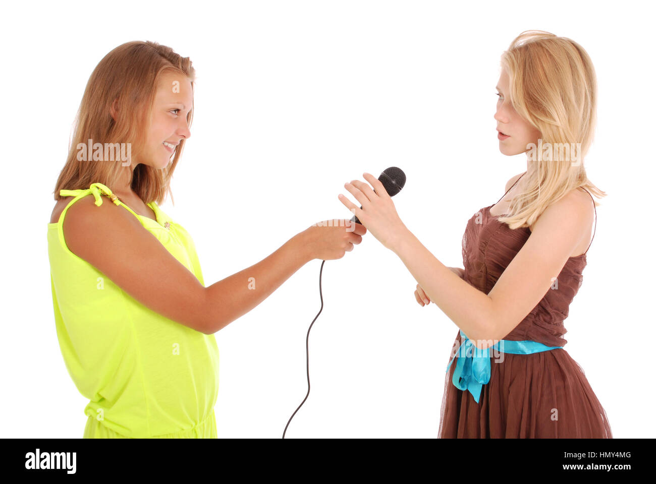 Young beautiful teenage girl conducts interviews with the singer ...