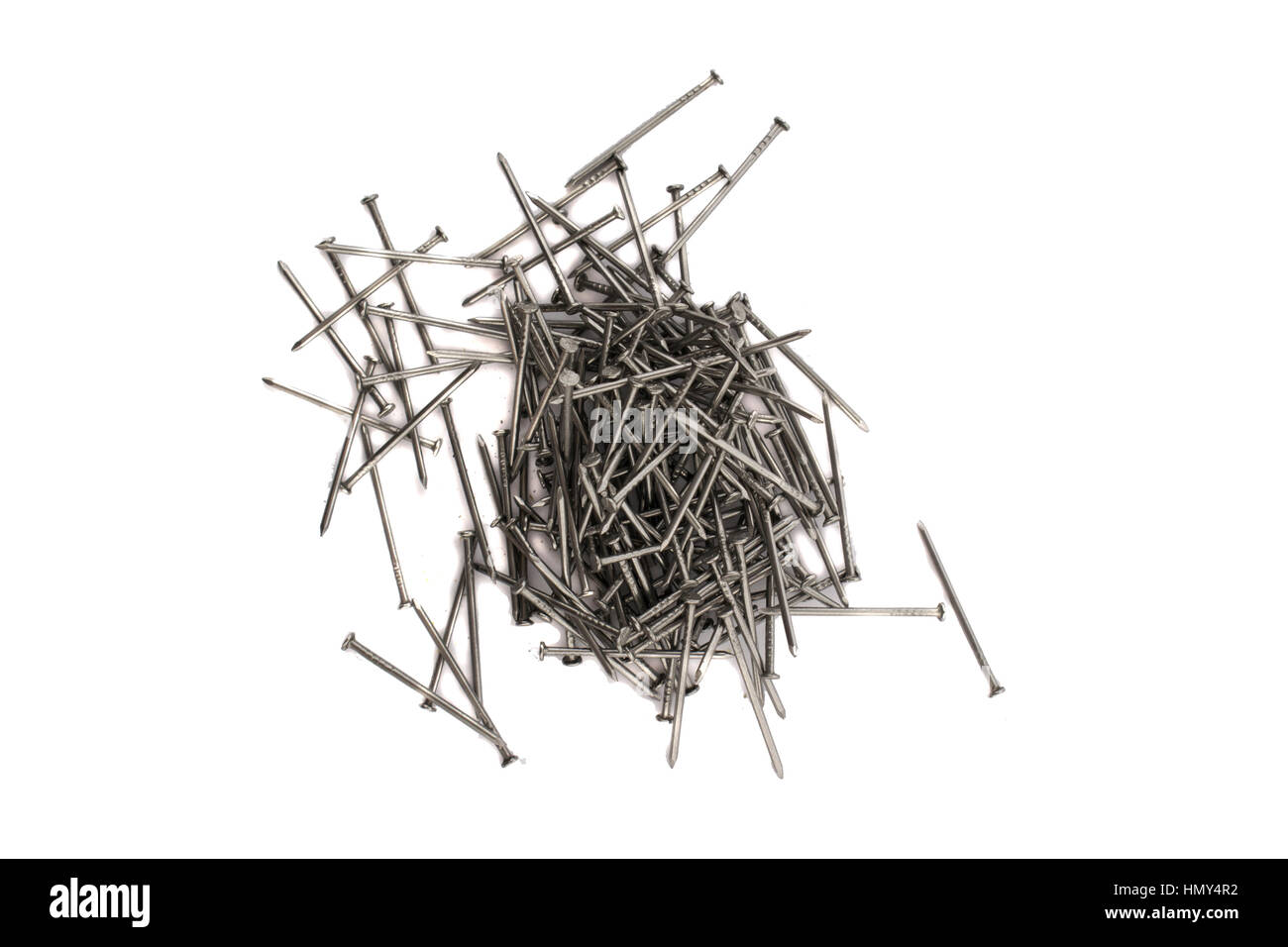 Steel nails on white background Stock Photo - Alamy