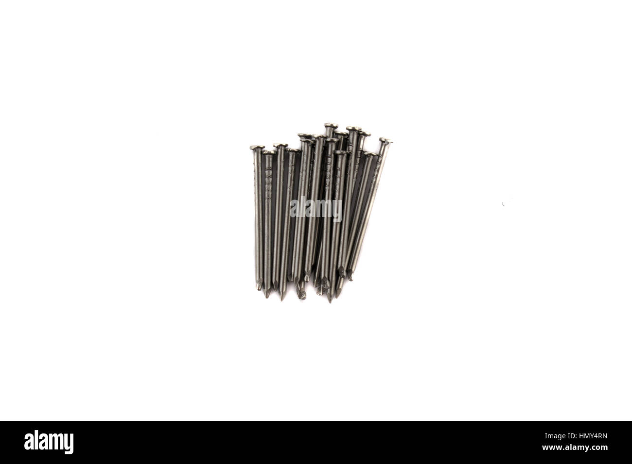 Steel nails on white background Stock Photo - Alamy