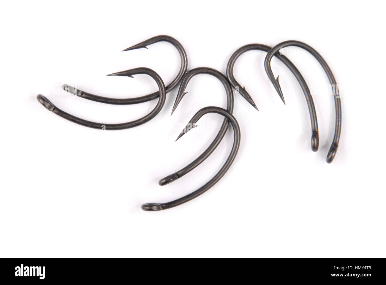 Sharp steel fishing hooks isolated on white background with soft shadow ...