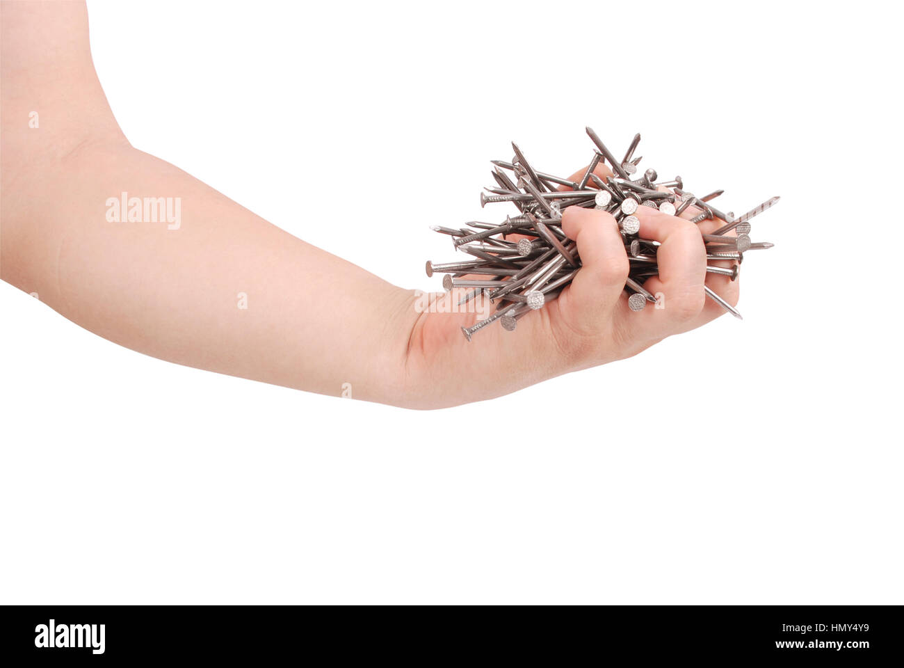 Man's hand holding metal nails. Closeup with clipping path isolated on ...