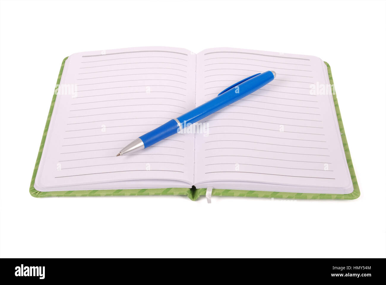 Green notebook with blue pen isolated on white background with soft ...