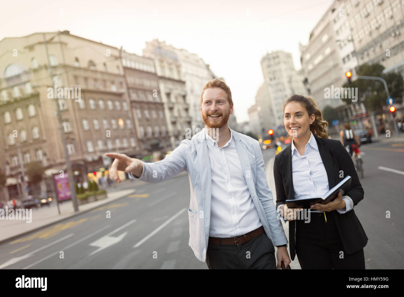 Businesspeople commuting and walking in busy city together Stock Photo ...