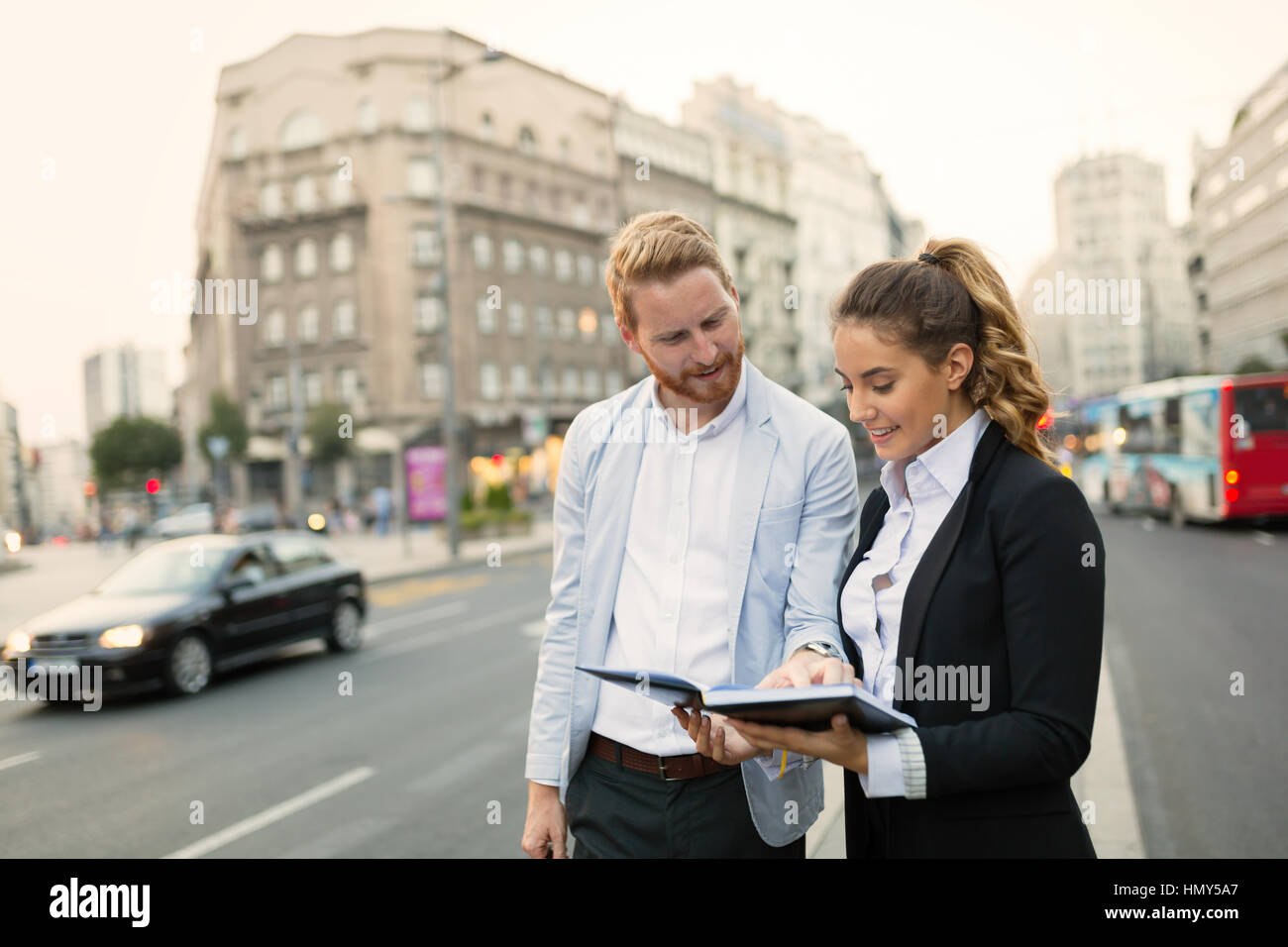 Businesspeople commuting and walking in busy city together Stock Photo ...