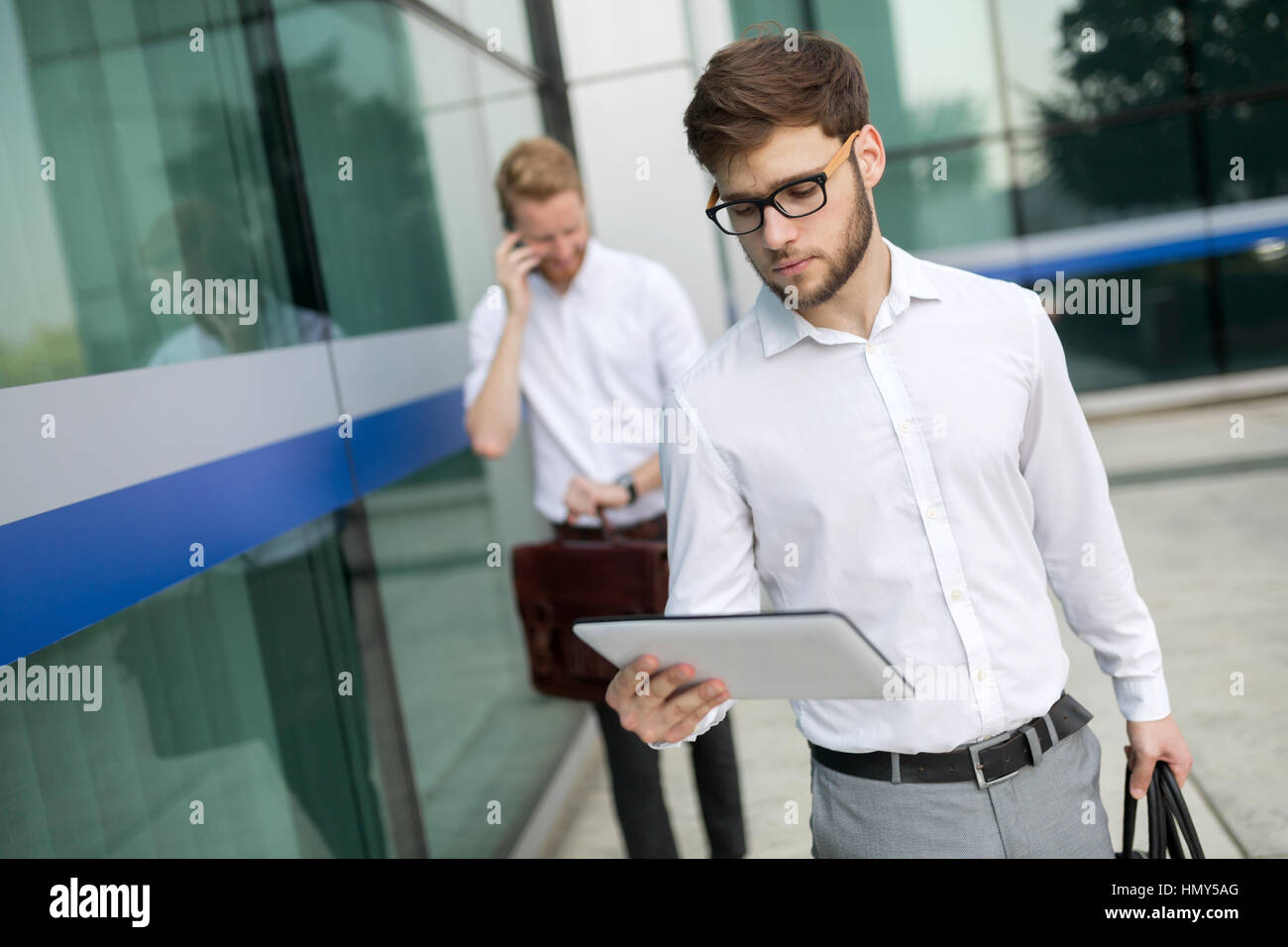 Business people going to work and carrying smart technology Stock Photo ...