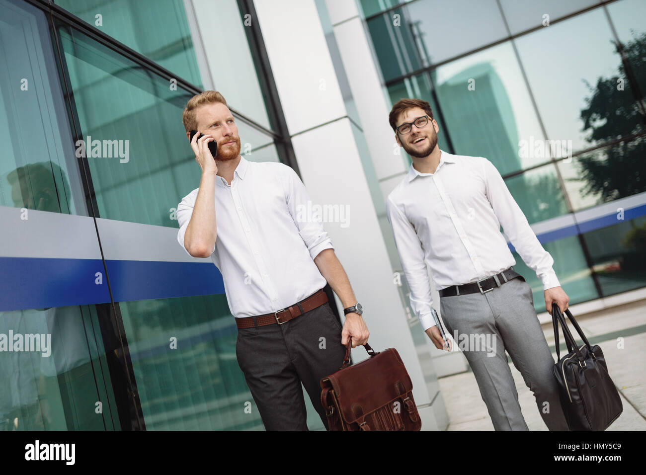 Business people going to work and carrying smart technology Stock Photo ...