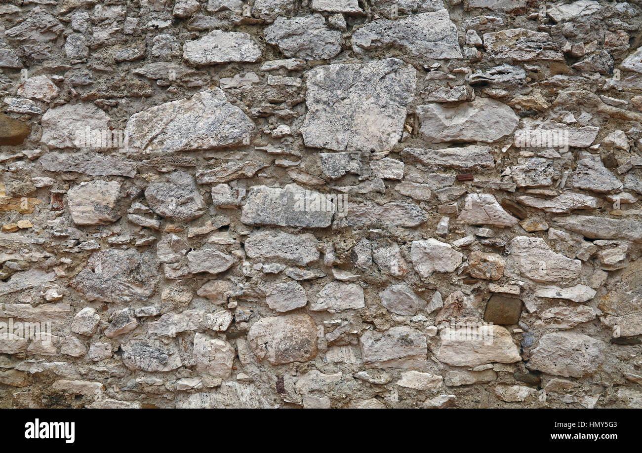 Antique medieval castle or fortress old rough white rock stone layered ...