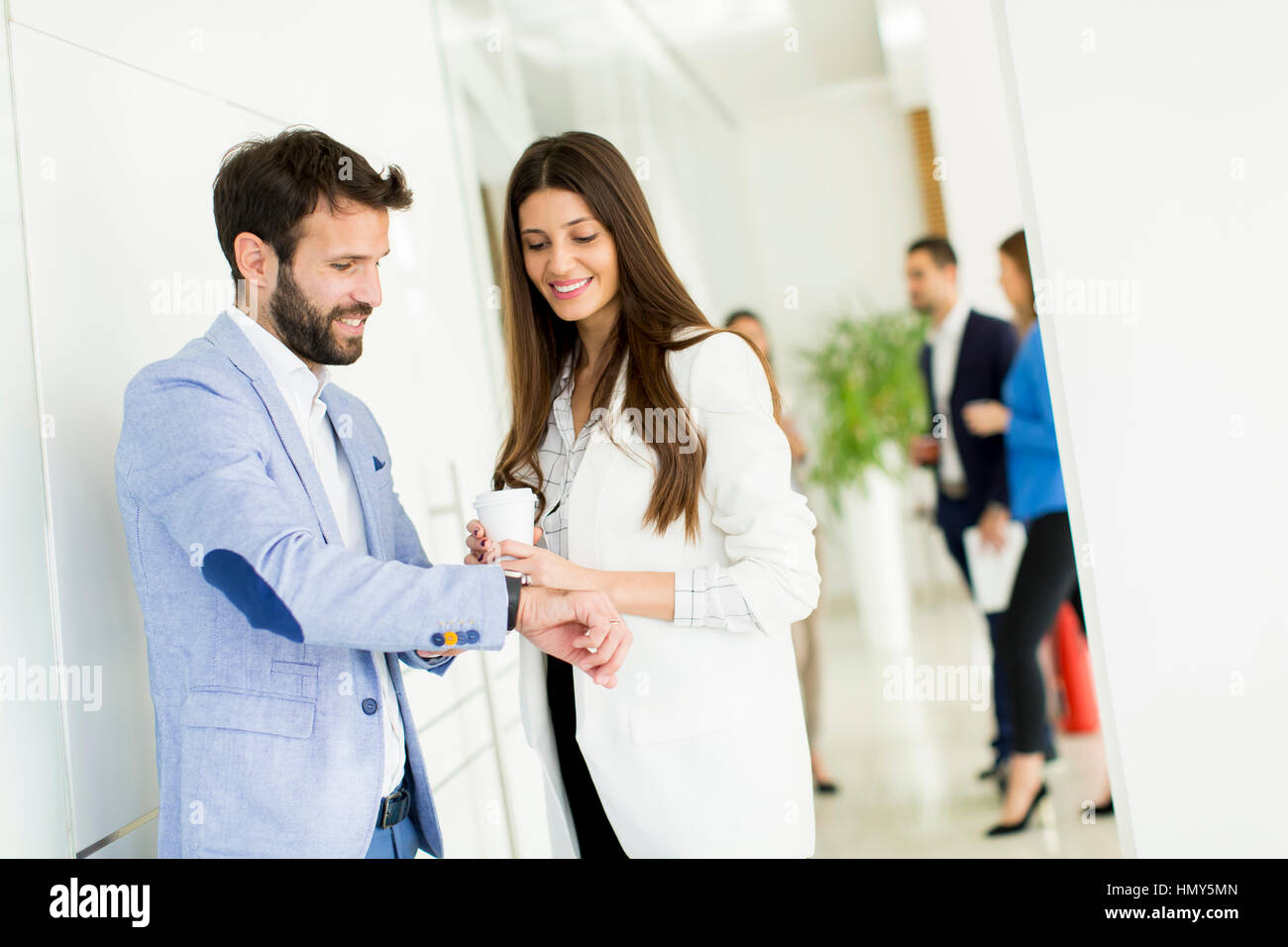 Business partners talking in modern office Stock Photo - Alamy