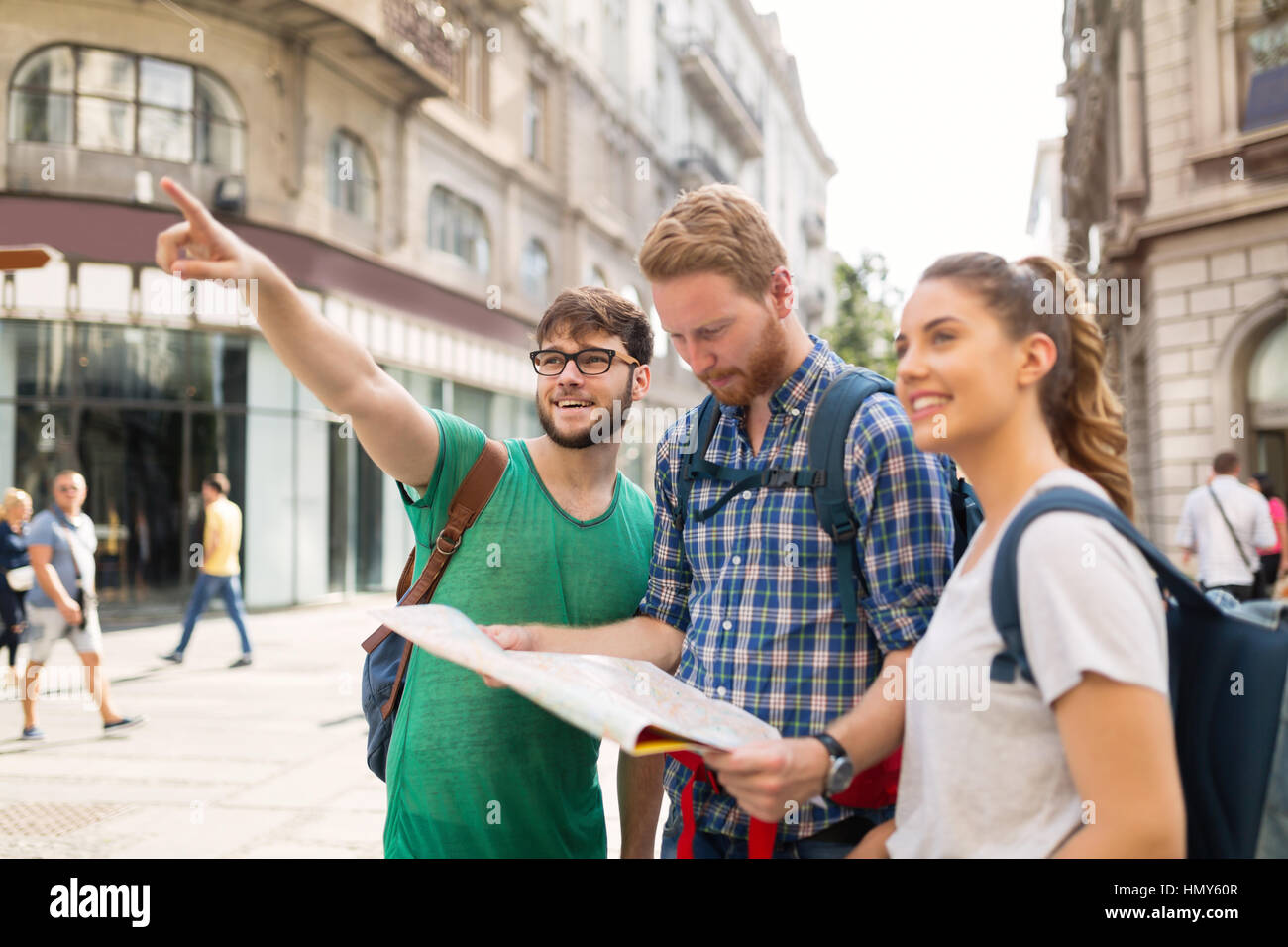 Happy group of students on sightseeing and travel adventure Stock Photo ...