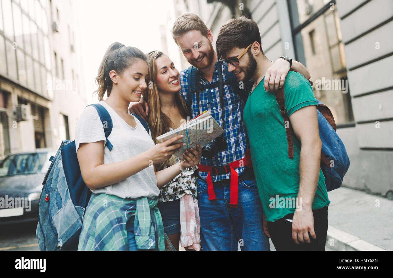 Happy tourists travelling and sightseeing city Stock Photo - Alamy