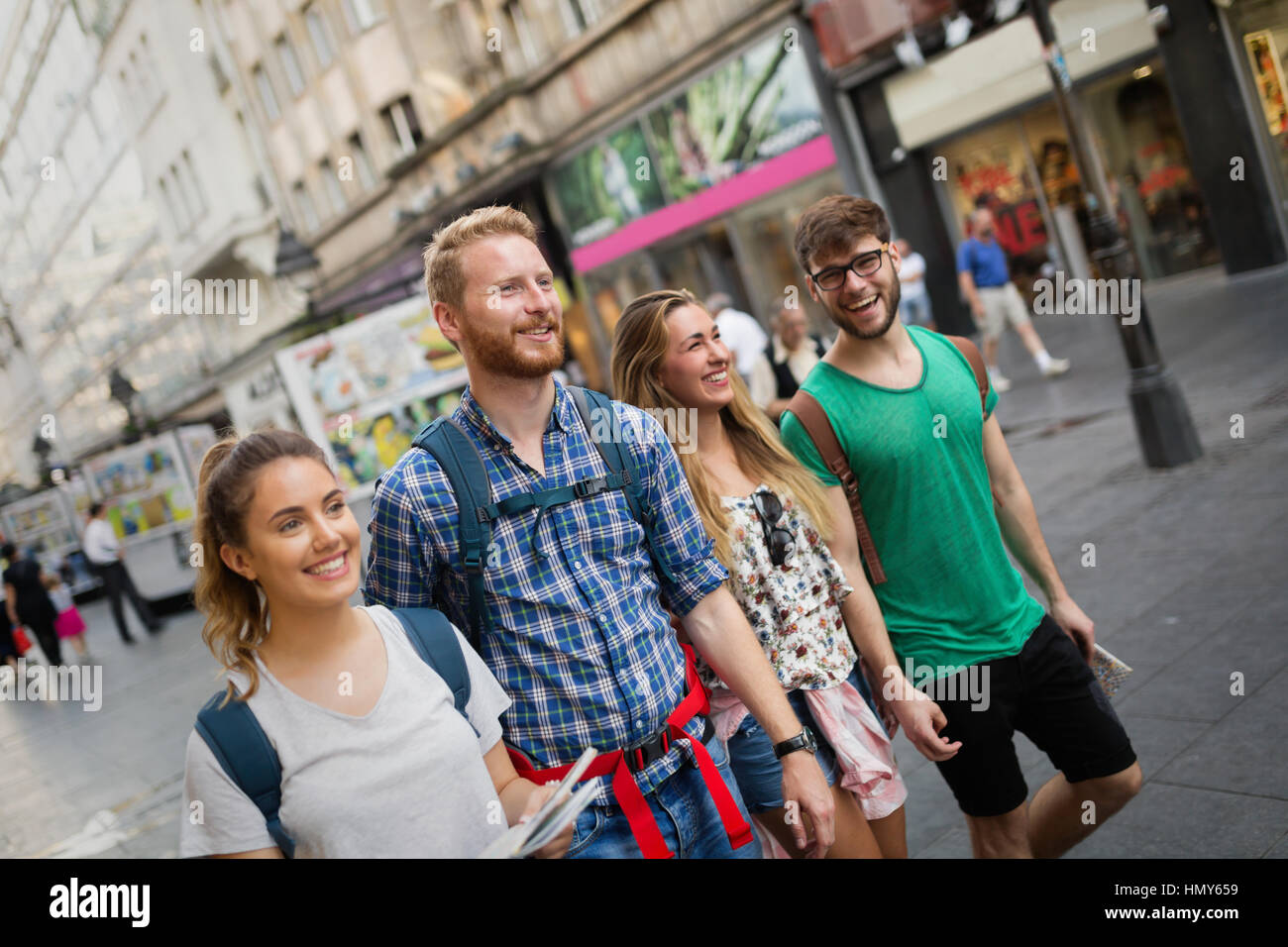 Tourist group of friends discovering city on foot and travelling Stock ...
