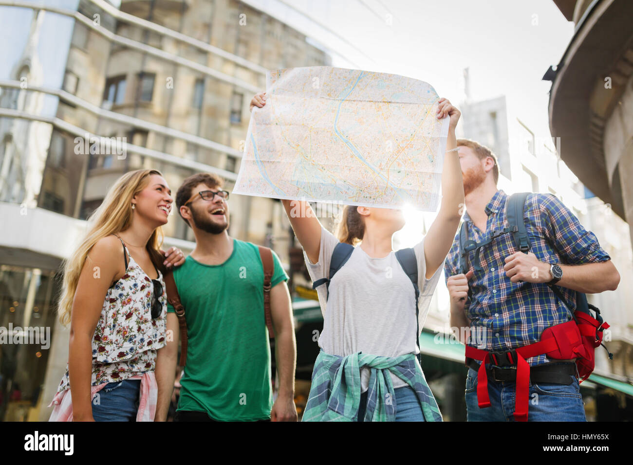 Tourist group of friends discovering city on foot and travelling Stock ...