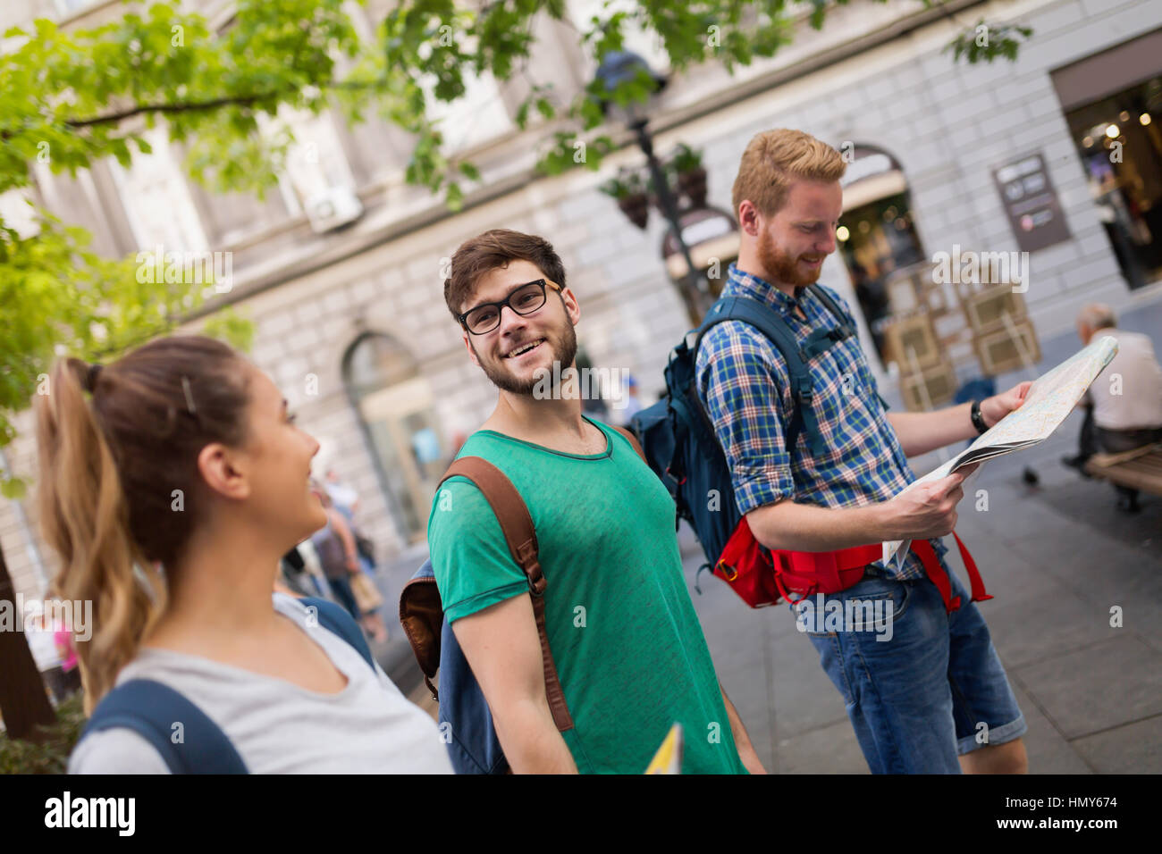 Happy group of tourists traveling and sightseeing together Stock Photo ...